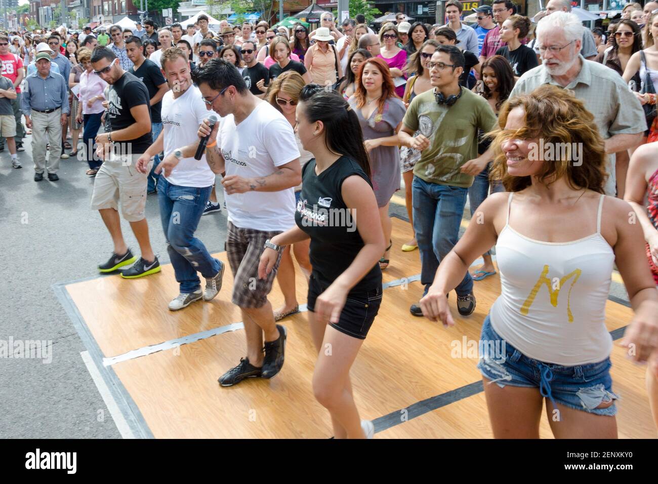 Salsa on St. Saint Clair Festival Scenes: A young man teaches salsa ...