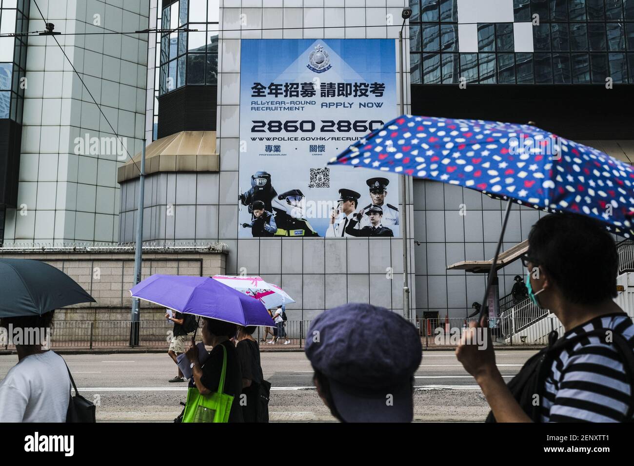 Protesters carry umbrellas during the demonstration. Protesters took ...