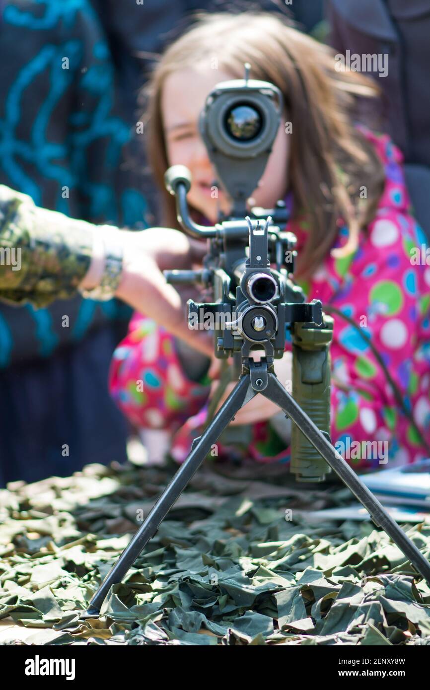 Canadian child girl with military gun Stock Photo - Alamy