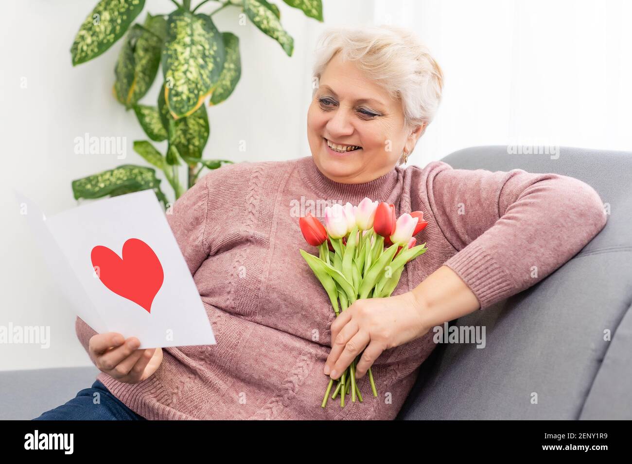 Elderly figure sits hi-res stock photography and images - Alamy