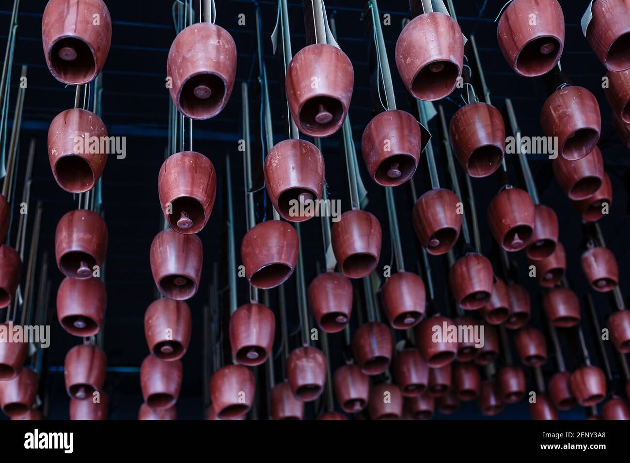 Giant wooden bell hanging on the ceiling Stock Photo - Alamy