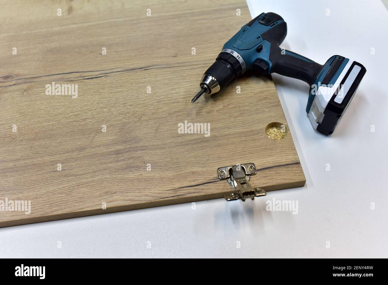 Cordless combi drill for assembly the furniture door hinges ot he ...