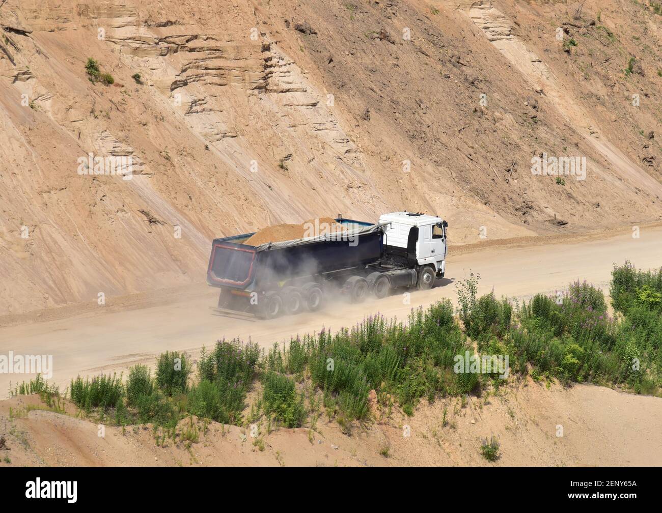 Truck with tipper semi trailer transported sand from the quarry. Dump ...