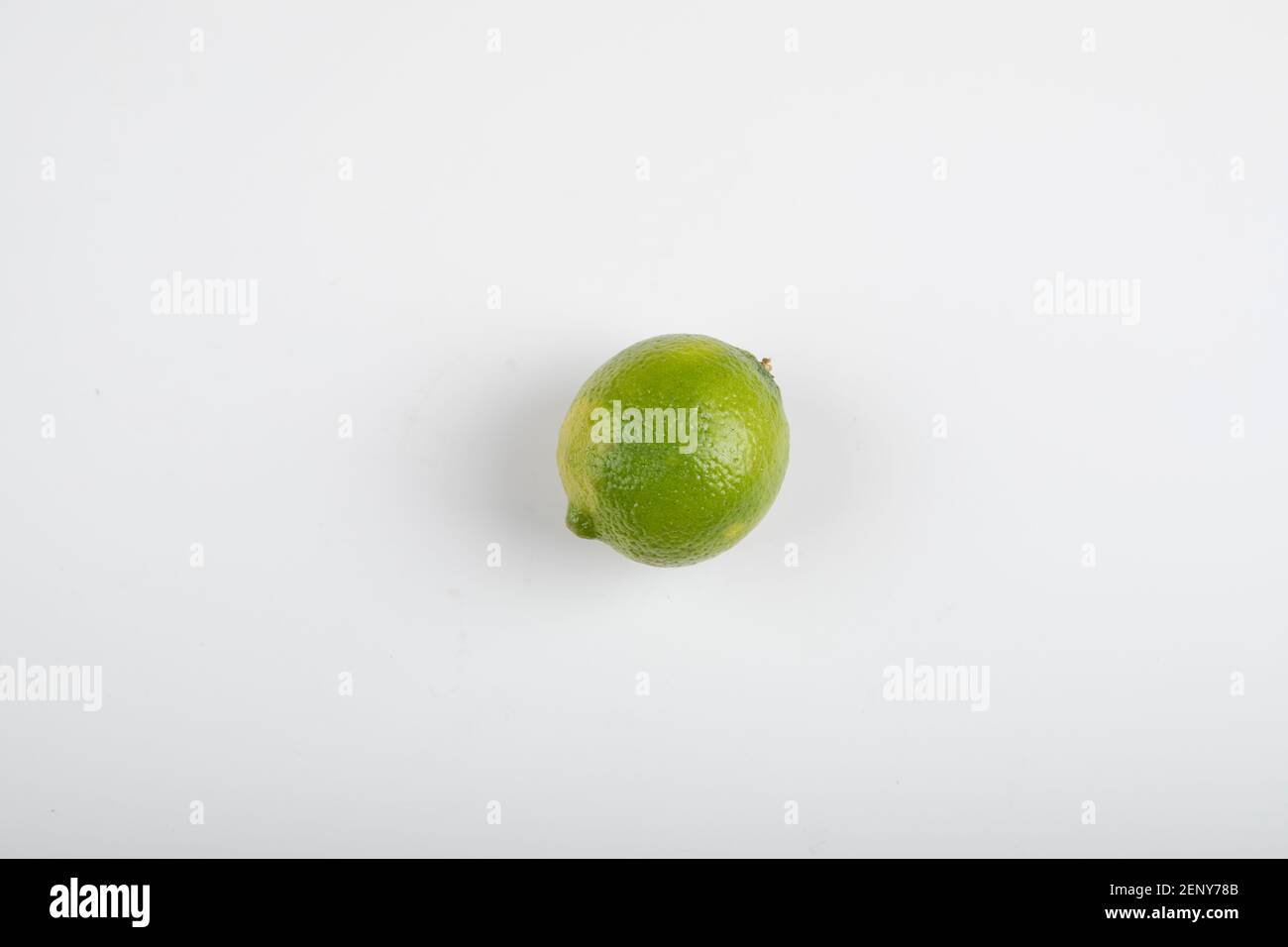 Single ripe lime fruit isolated on white background Stock Photo - Alamy