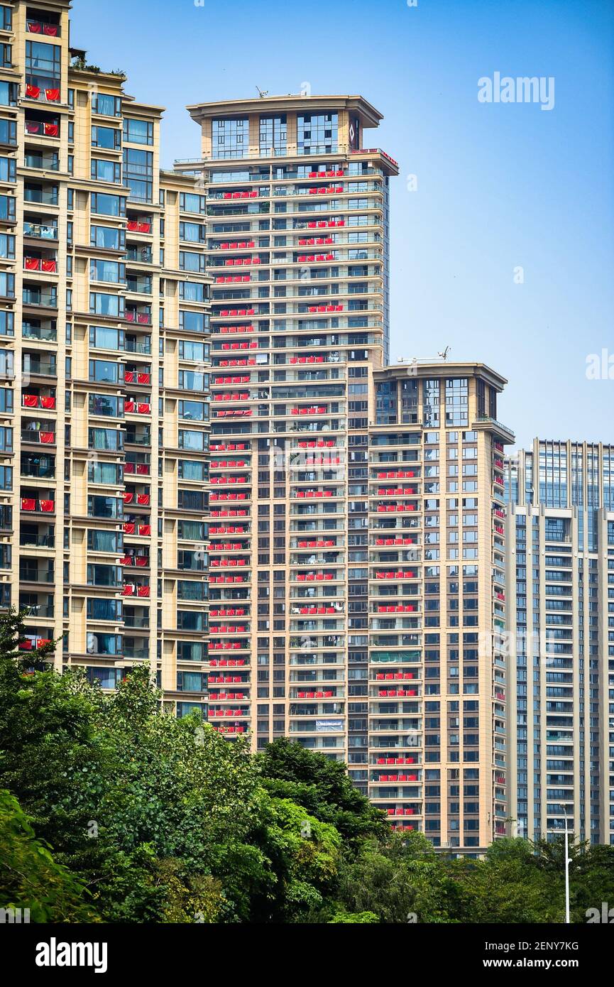 Resident buildings are decorated with national flags of PRC, which face ...