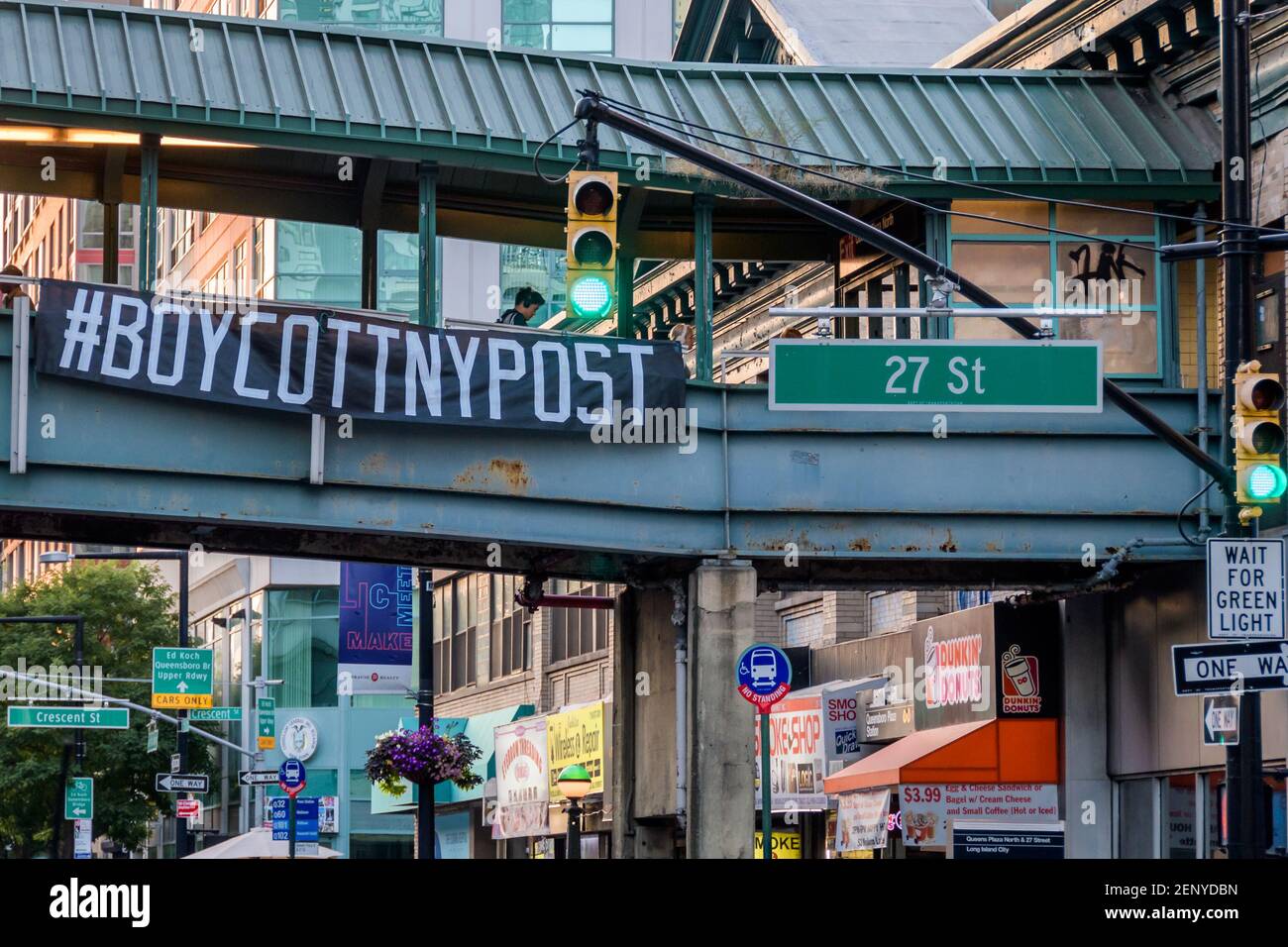 BOYCOTT NY POST banner drop at Queensboro Plaza. Members of the Boycott ...