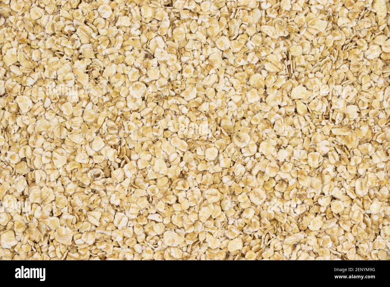 Oat flakes forming a textured background. Grained texture. Top view ...