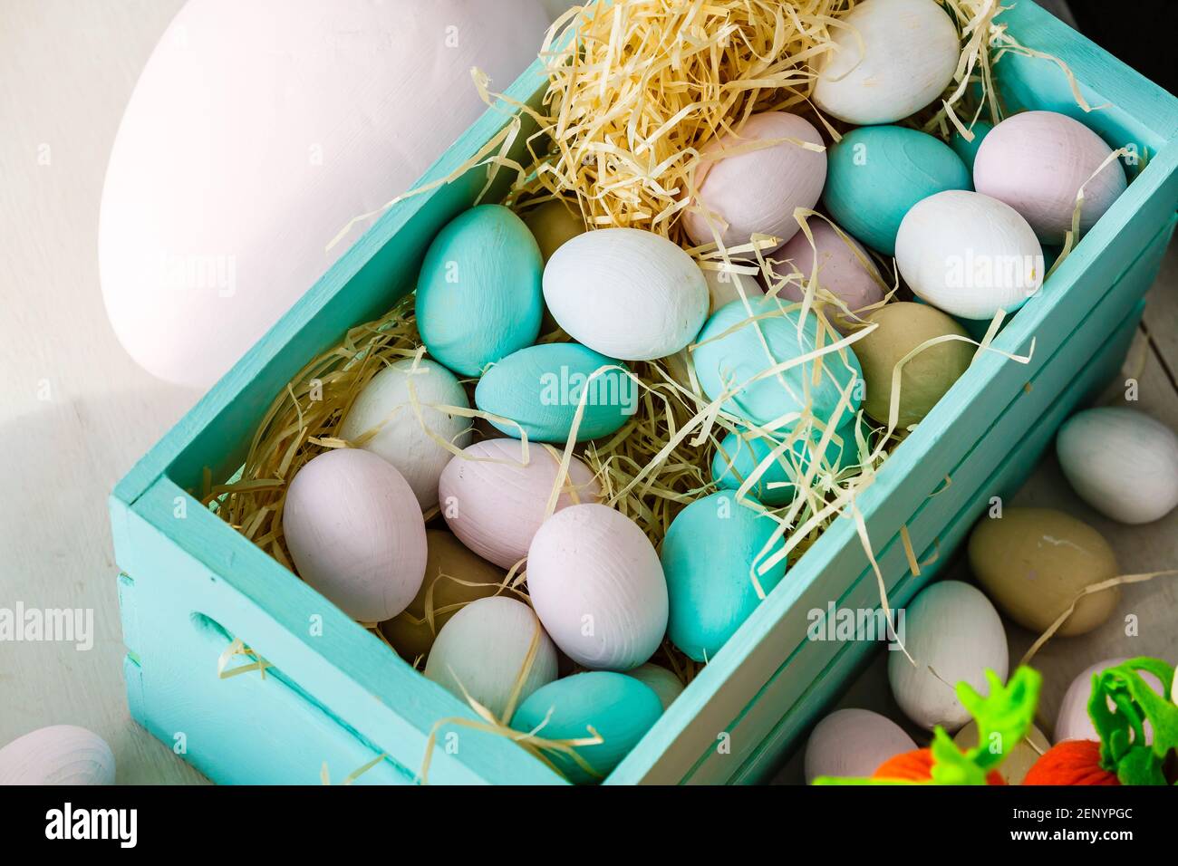 Easter eggs in a box wooden background Stock Photo - Alamy