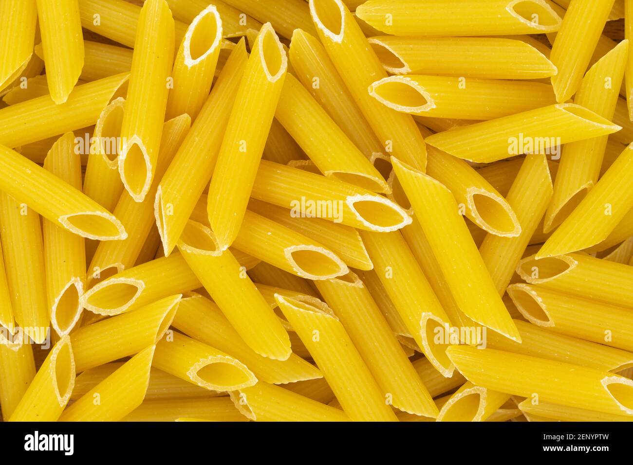 Raw penne rigate pasta texture background. Flatlay style. Traditional ...