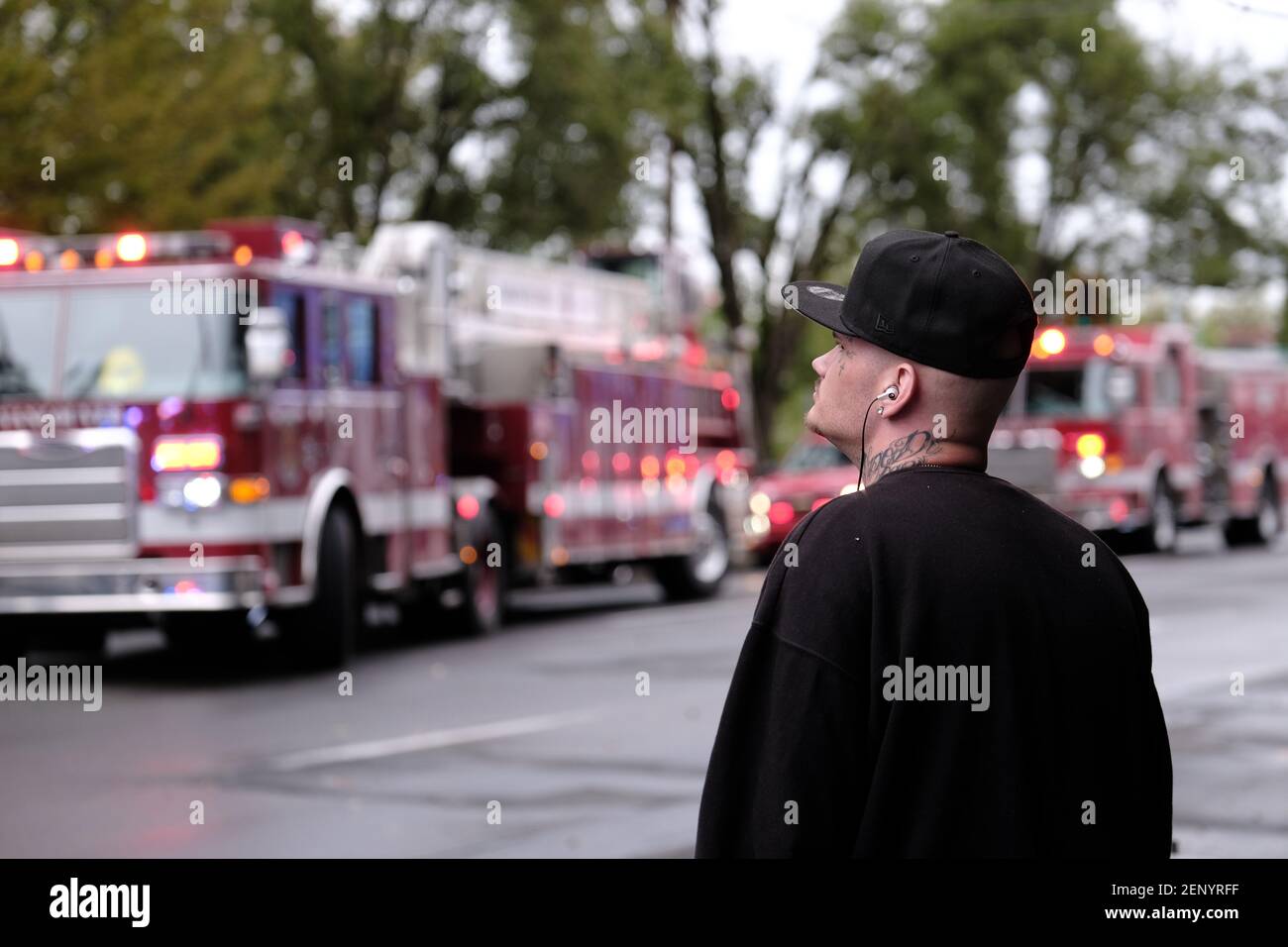 A man watches as police respond to a shooting at the Smith Tower ...