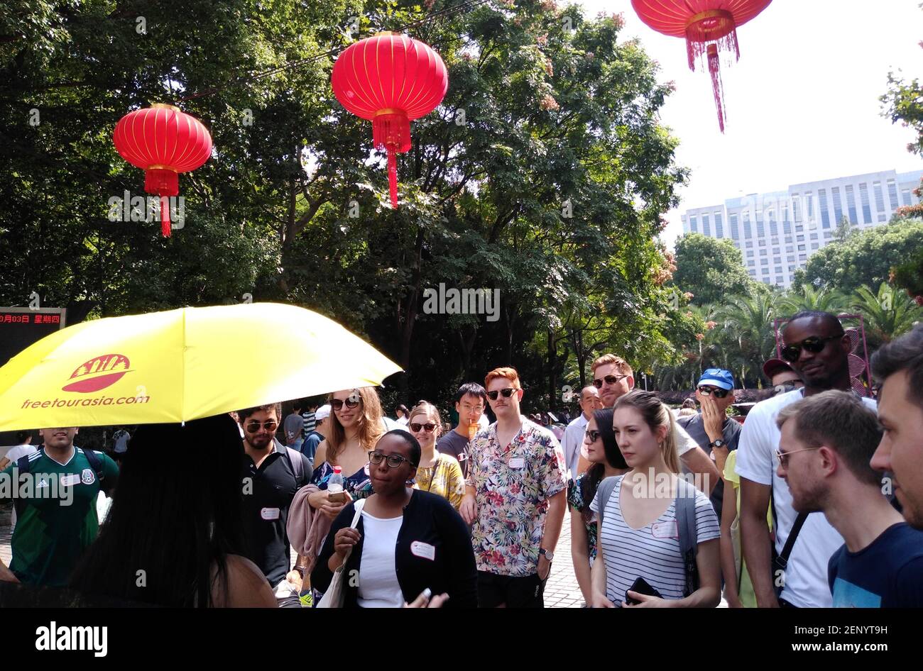 A tour guid introduces the Marriage Market to tourists at the People's ...