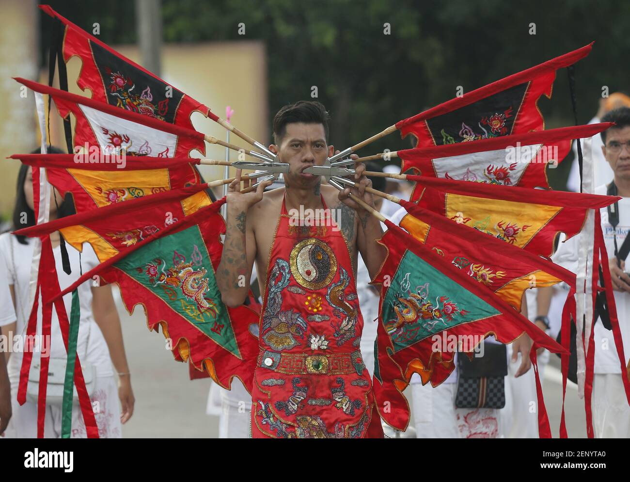 A devotee of the Chinese Bang Neow shrine with his face pierced with ...