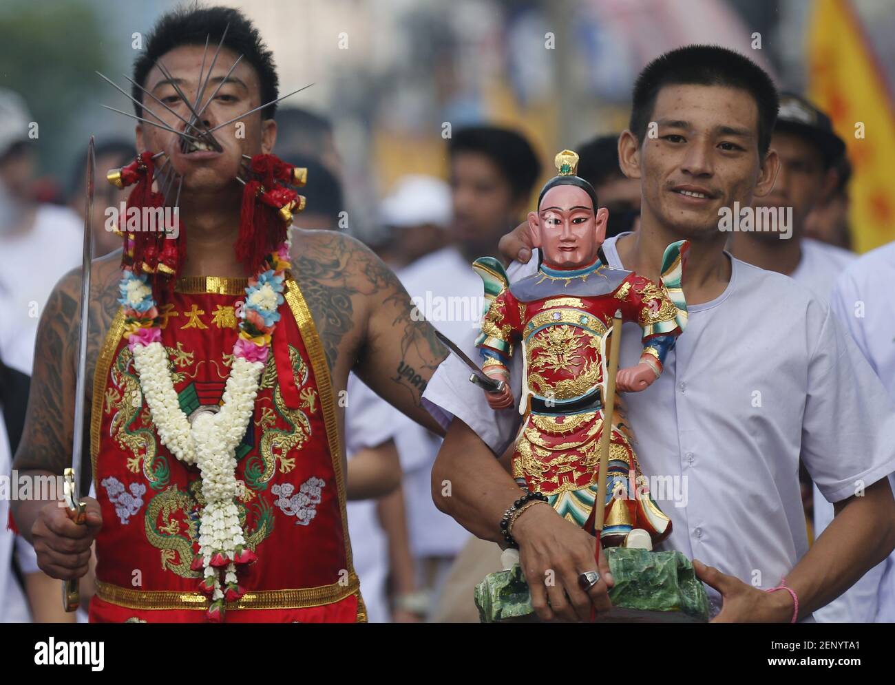 A devotee of the Chinese Bang Neow shrine with his face pierced with ...