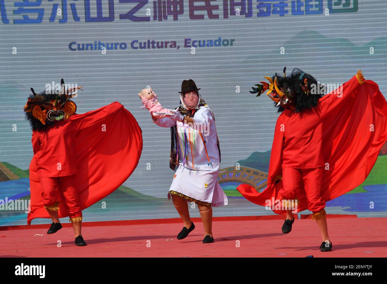 Ecuadorian artisits of Cuniburo Cultura dressed up in dance customes ...