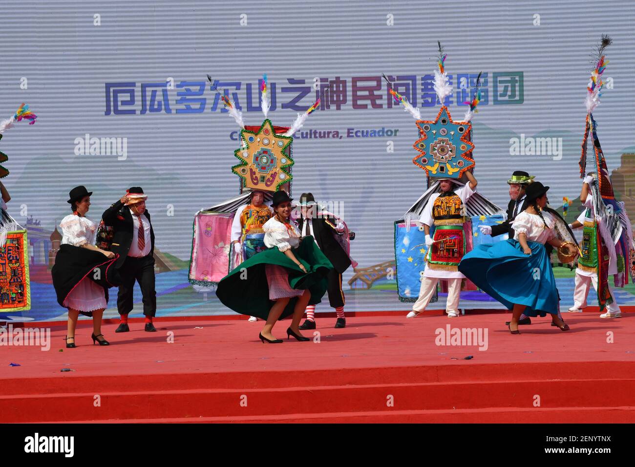 Ecuadorian artisits of Cuniburo Cultura dressed up in dance customes ...