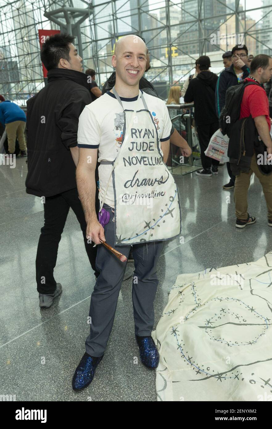 Artist Ryan Jude Novelline draws poses during New York Comic Con at Jacob Javits Center (Photo ...