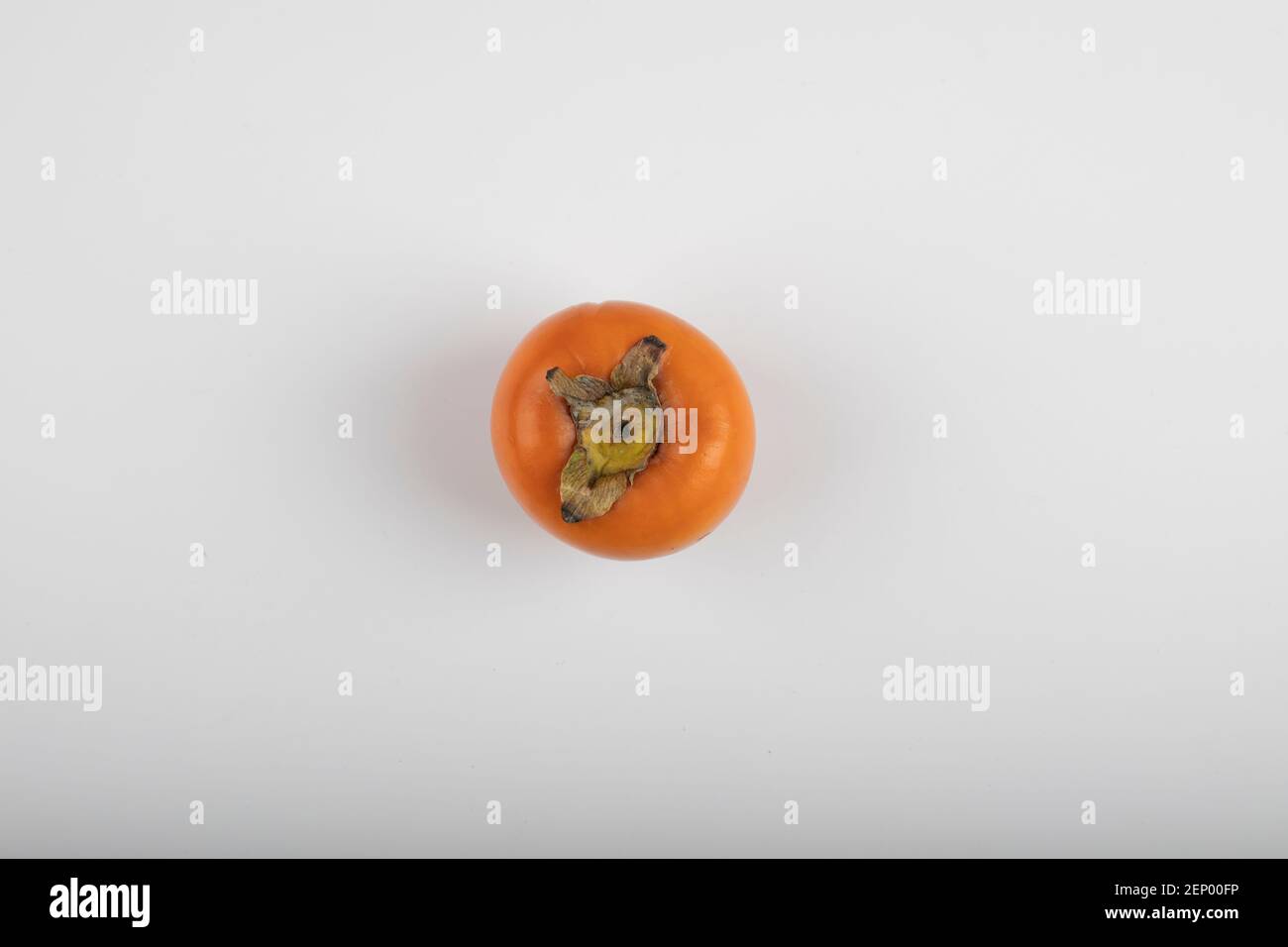 Single persimmon kaki fruit isolated on white background Stock Photo ...