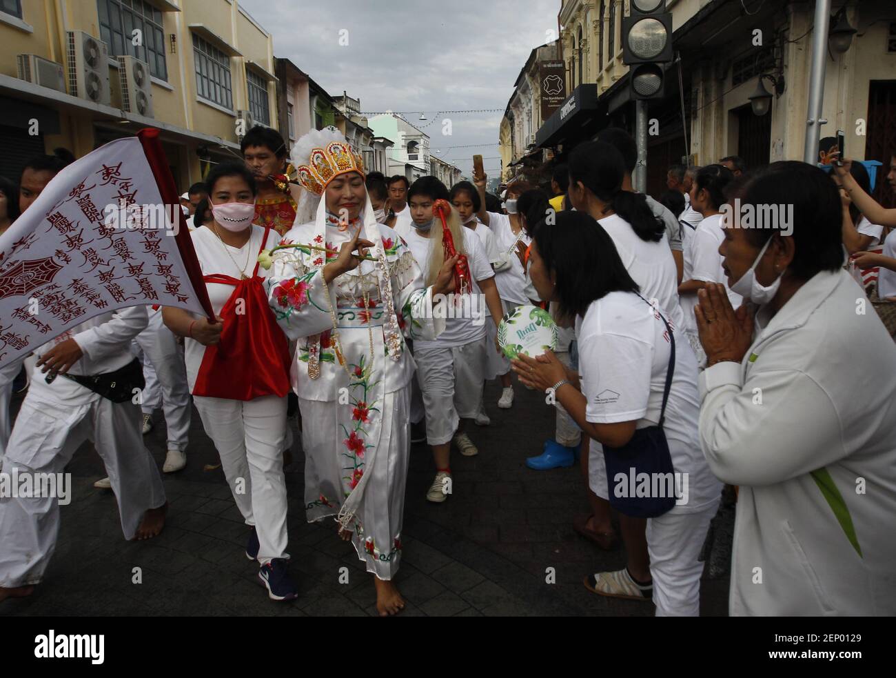 A devotee of the Chinese Jui Tui shrine take part in a procession ...