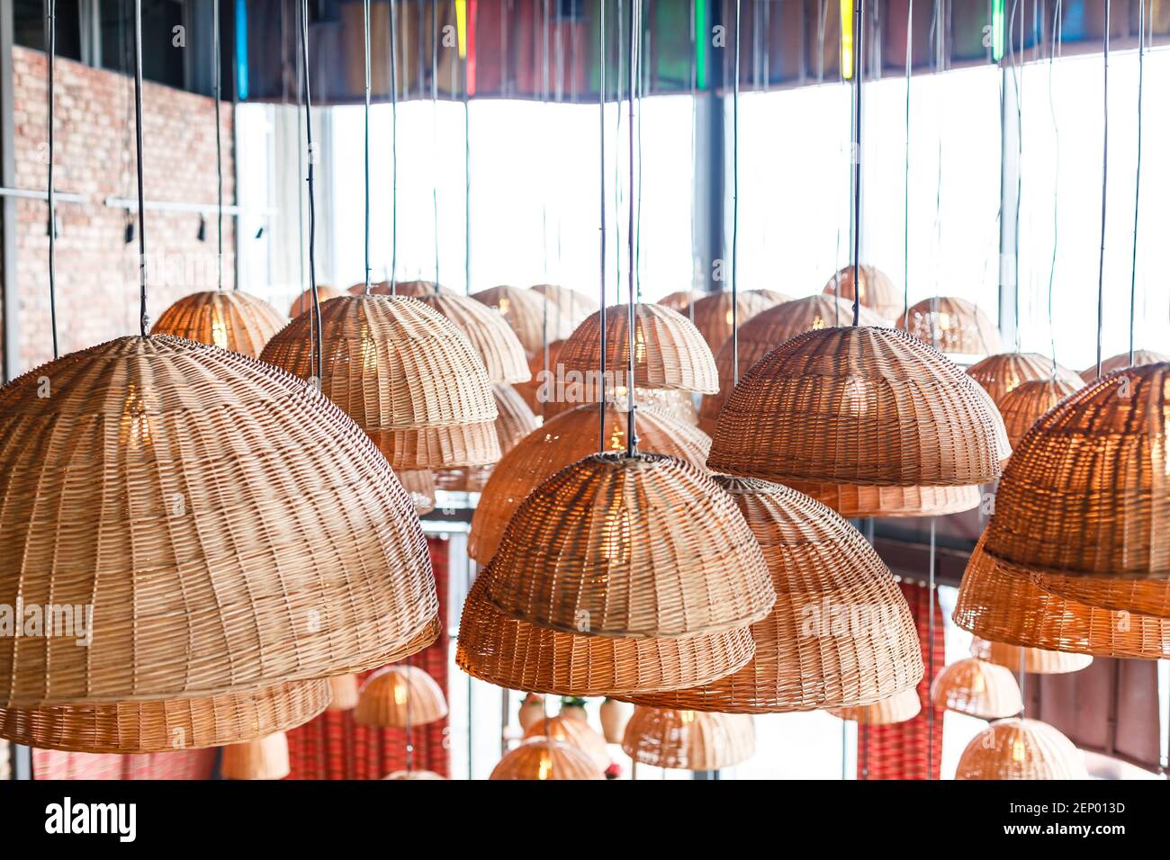 lamps in straw shades on the ceiling for decoration Stock Photo - Alamy