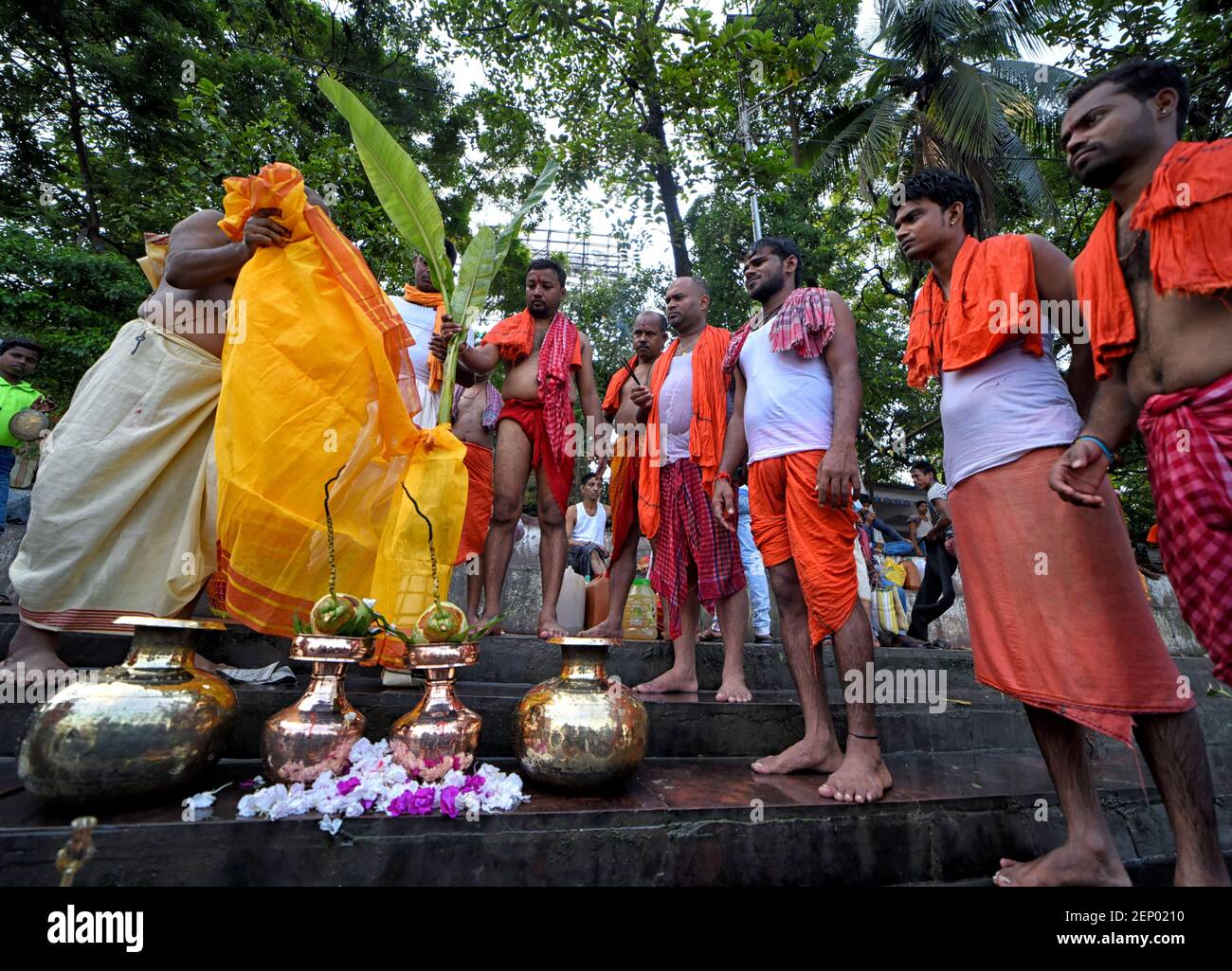 Hindu people seen with a banana plant to mark Nabapatrika, the banana ...
