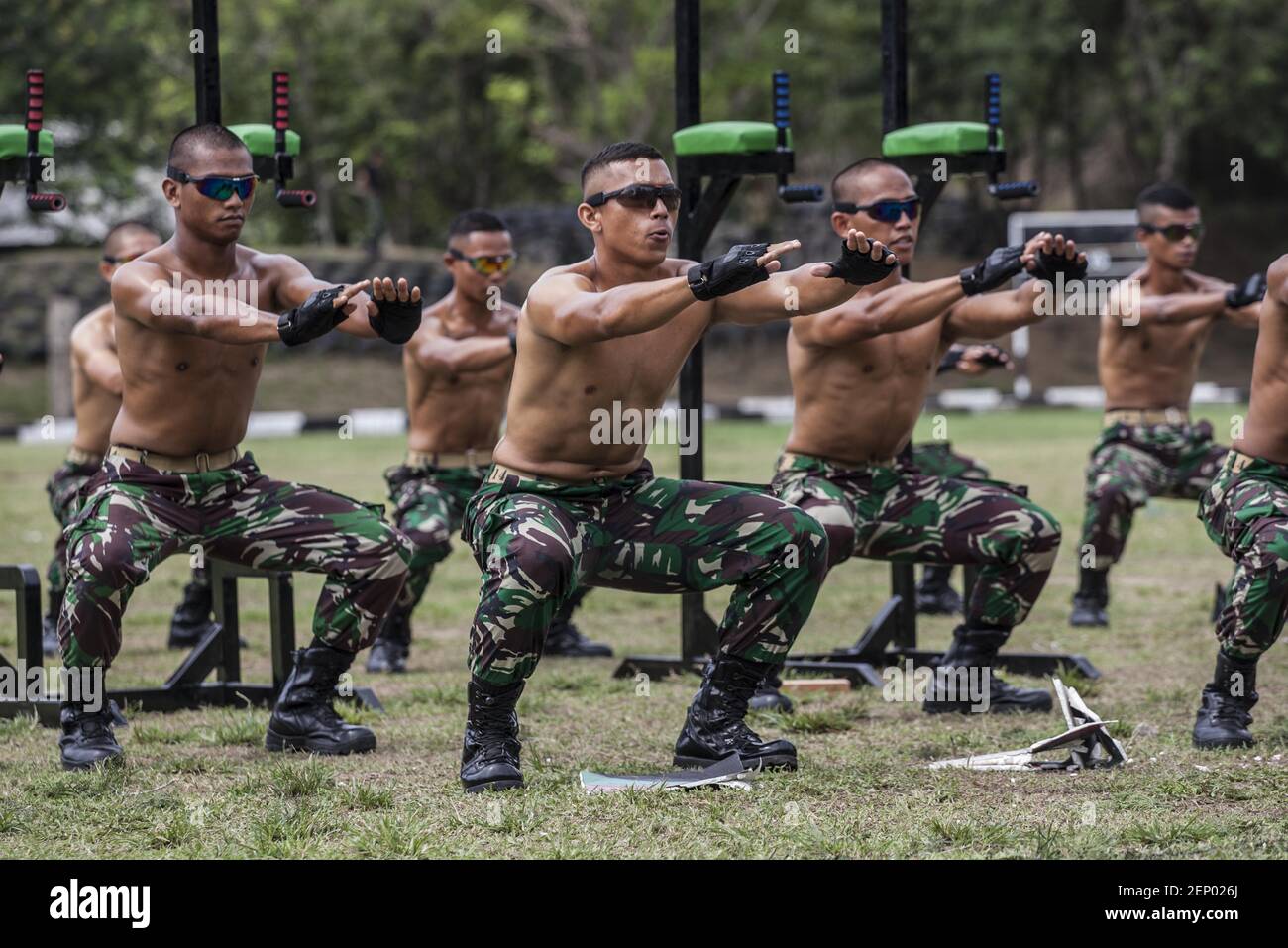 Indonesia army take part in performs a body building to mark the 74th ...