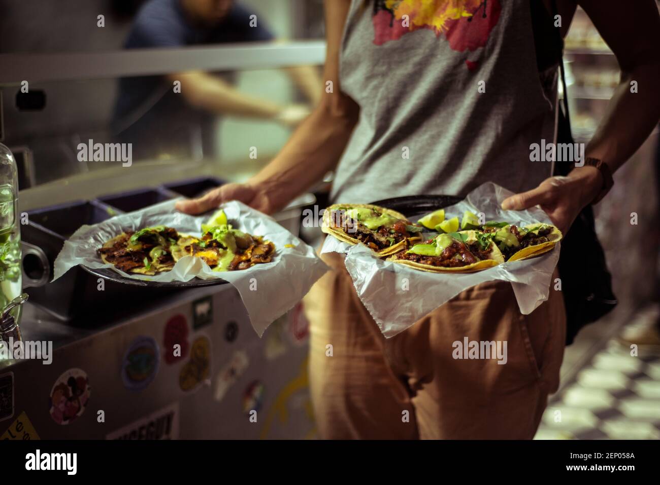 Healthy Mexican taco street food held by strong healthy tourist Stock ...
