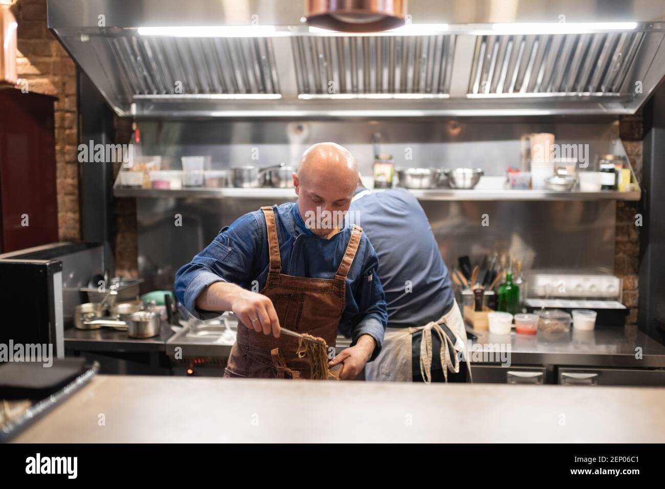Chef behind restaurant counter hi-res stock photography and images - Alamy
