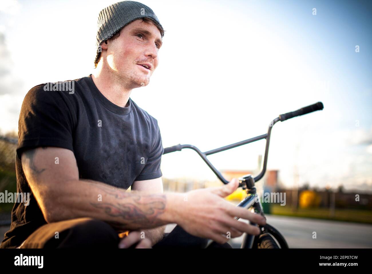 Portrait of bmxer in skate park sitting on bike Stock Photo - Alamy