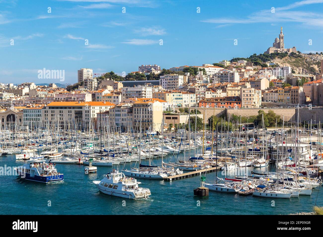 Aerial panoramic view on basilica of Notre Dame de la Garde and old port in Marseille, France ...