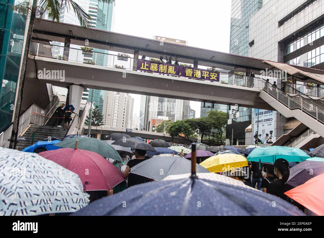 Riot police lookout from above bridge during the demonstration ...