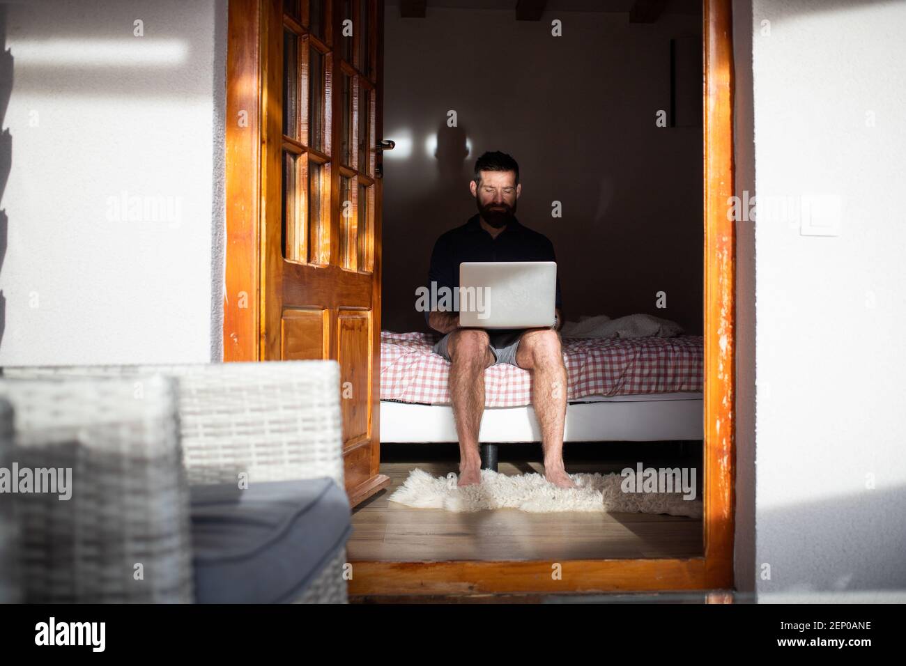 handsome man working remotely from a cottage Stock Photo - Alamy