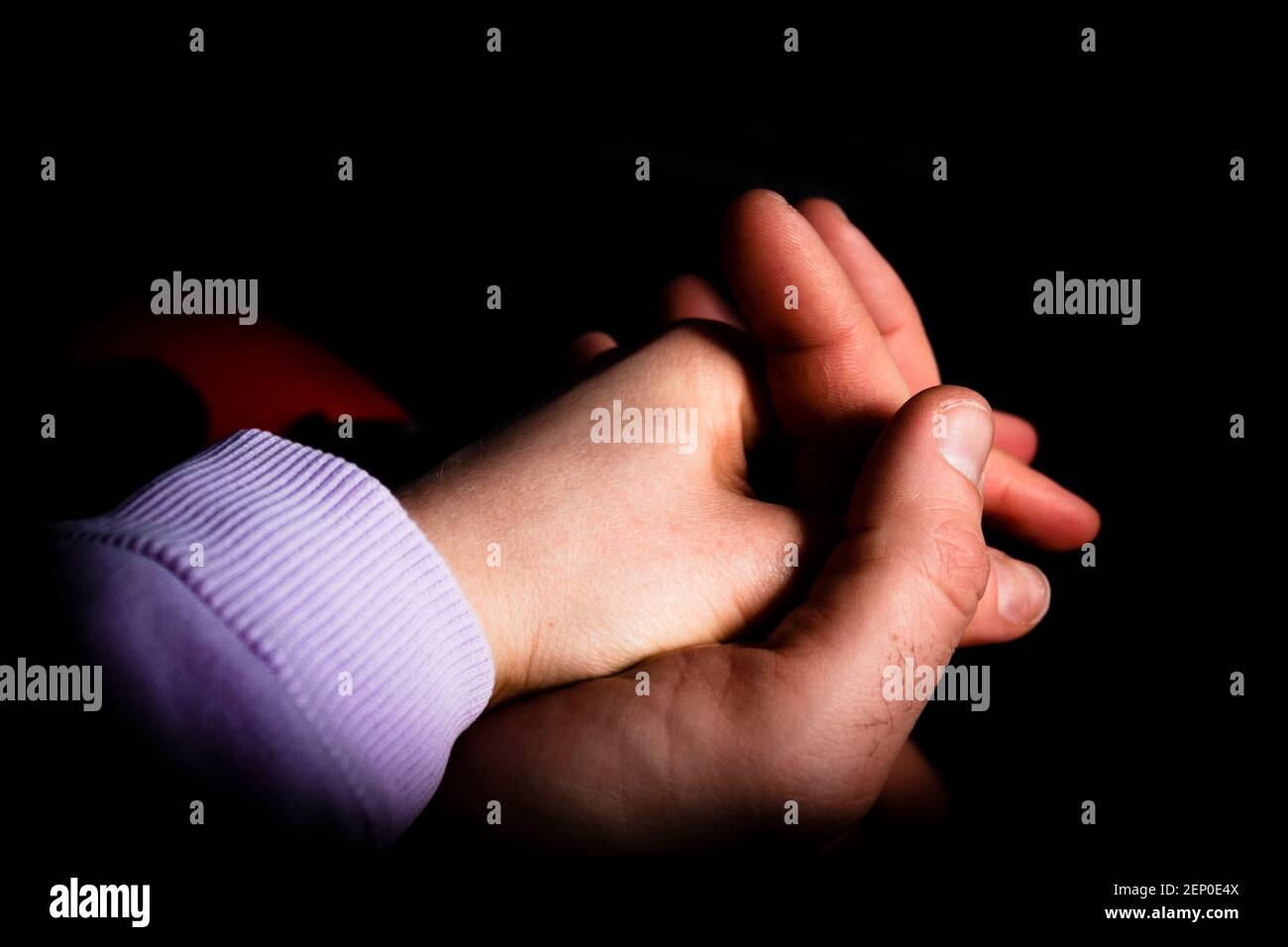 hand in hand with caring for each other Stock Photo - Alamy