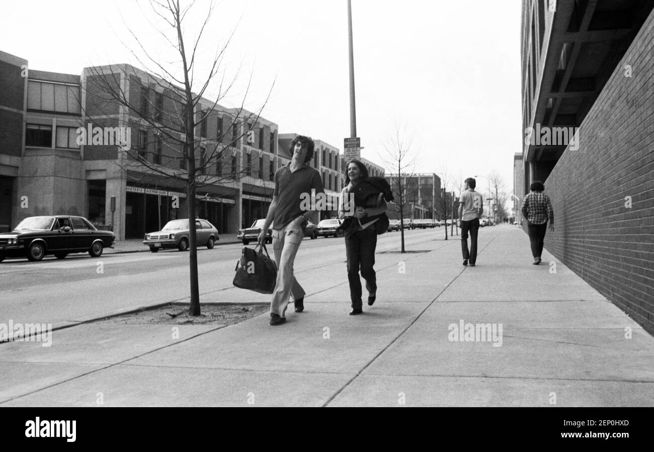 People walk on the sidewalk. Philadelphia, USA, 1976 Stock Photo - Alamy