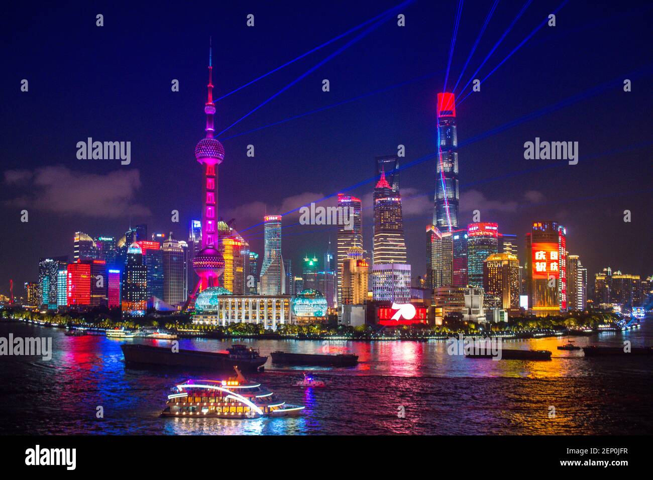 A grand light show is performed at the Bund with local landmarks as ...