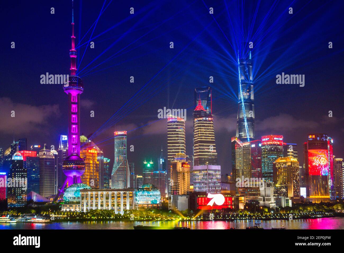A grand light show is performed at the Bund with local landmarks as ...