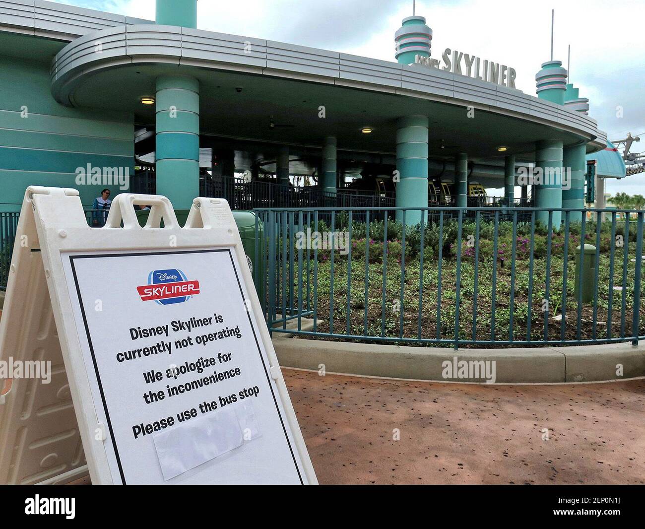 A sign announces that the Disney Skyliner system is closed at the ...