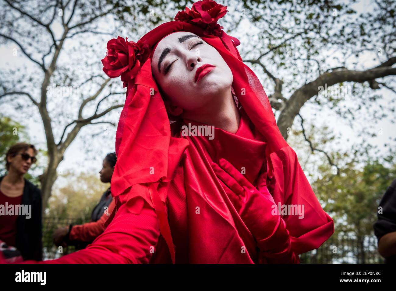 XR Red Rebel Brigade march in the Extinction Rebellion procession as ...