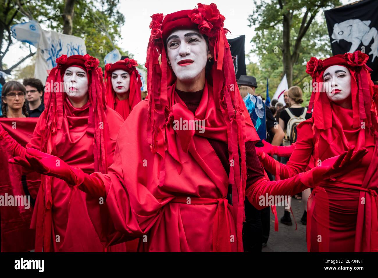 XR Red Rebel Brigade march in the Extinction Rebellion procession as ...