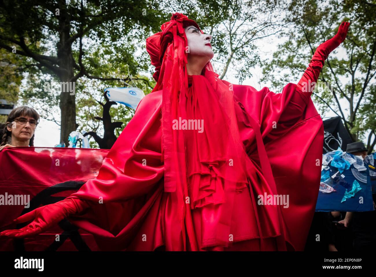XR Red Rebel Brigade march in the Extinction Rebellion procession as ...