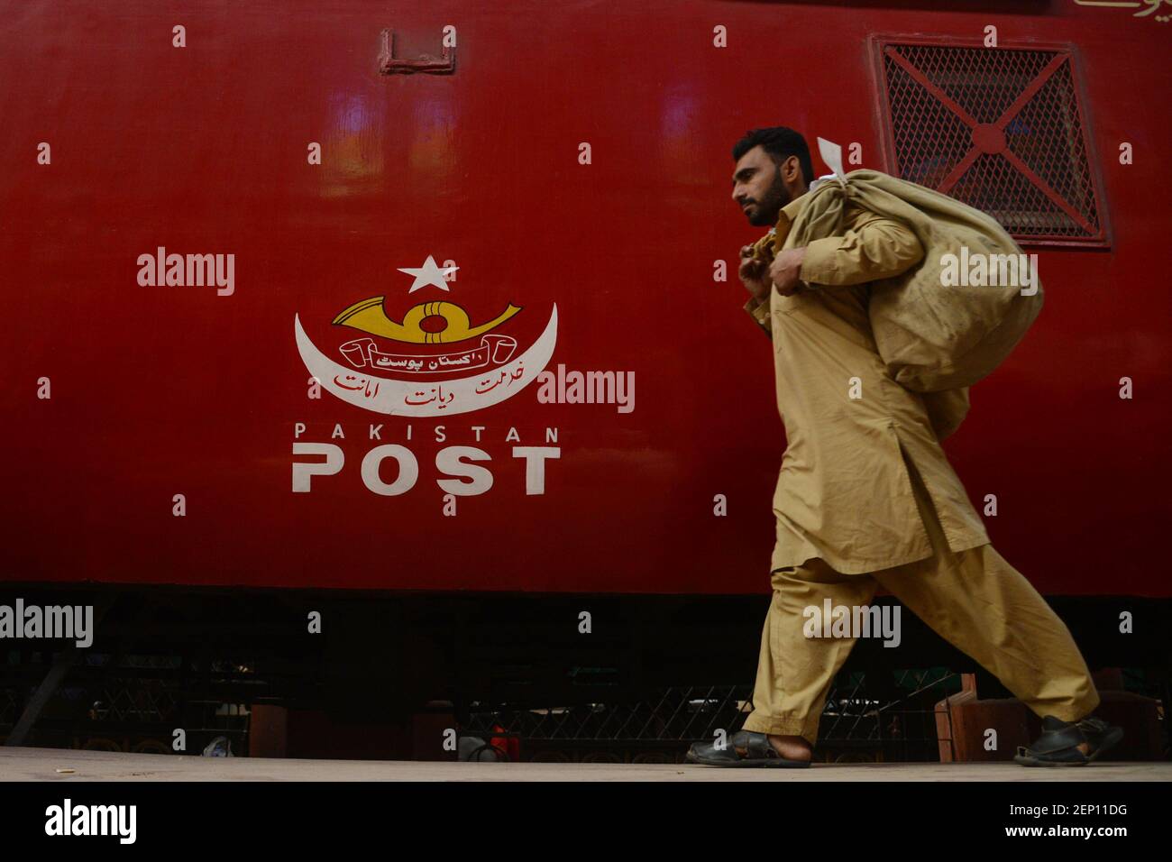Pakistani post office worker sorts mails after it was unloaded from ...