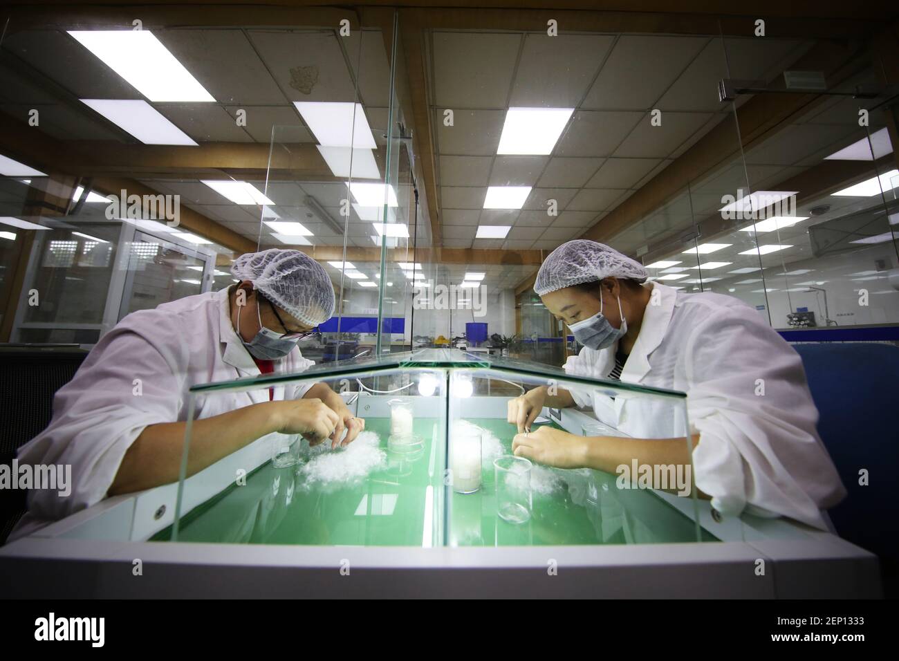 Workers make jackets at a factory of Bosideng, the leading Chinese down ...