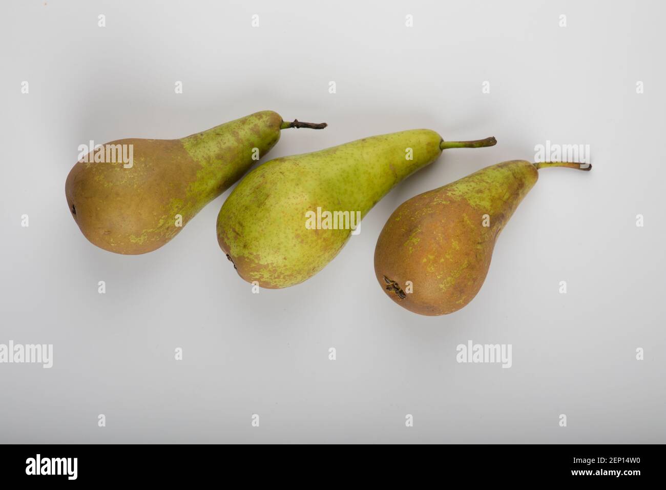 Three whole green pears isolated on white background Stock Photo - Alamy