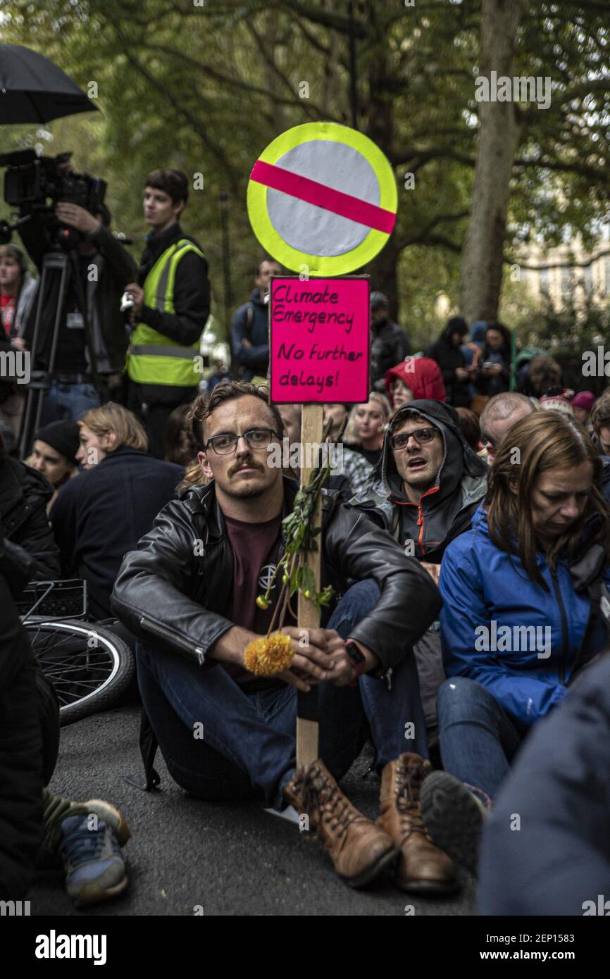 A protester holds a placard during the demonstration. Protesters took ...