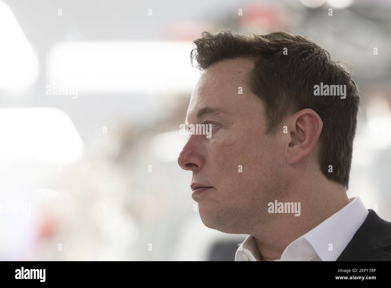 SpaceX Chief Engineer Elon Musk speaks to media in front of Crew Dragon ...