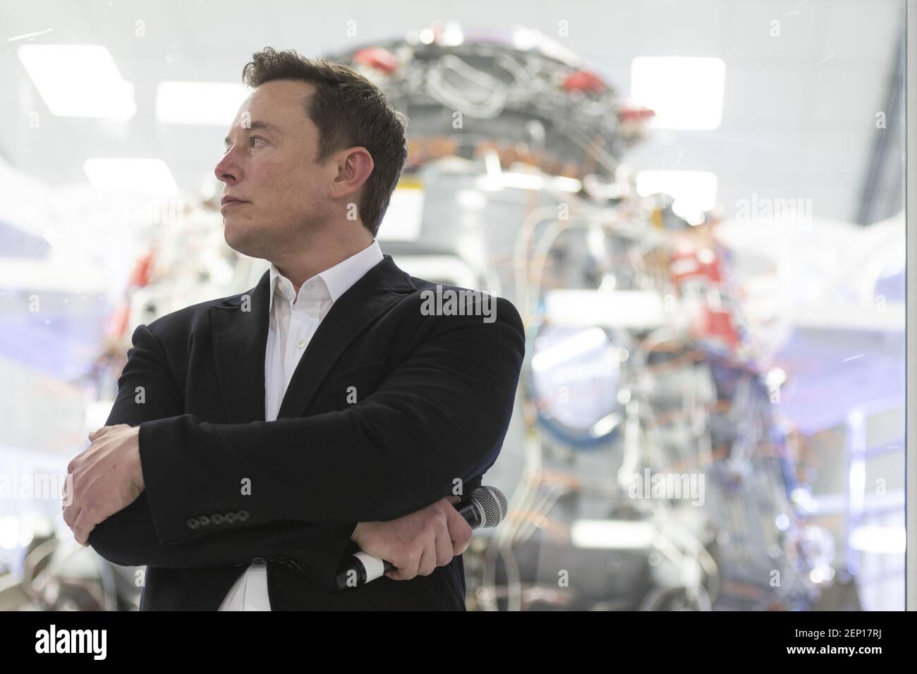SpaceX Chief Engineer Elon Musk speaks to media in front of Crew Dragon ...