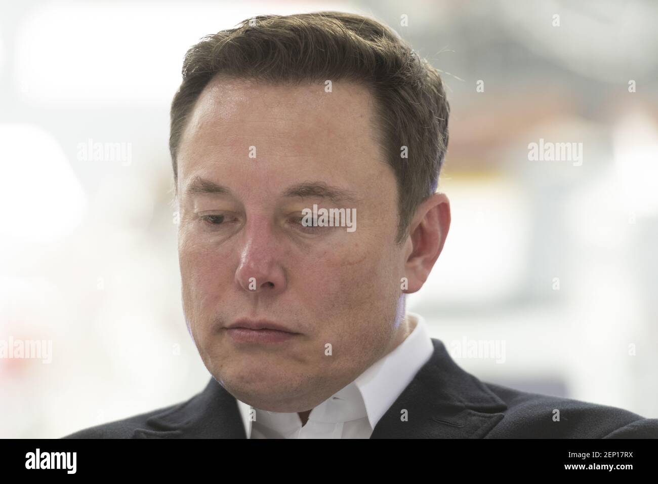 SpaceX Chief Engineer Elon Musk speaks to media in front of Crew Dragon ...
