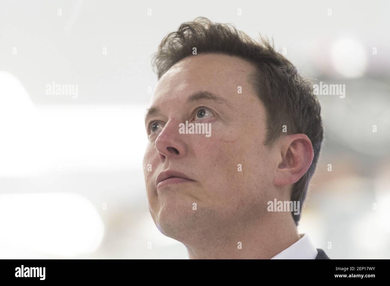 SpaceX Chief Engineer Elon Musk speaks to media in front of Crew Dragon ...