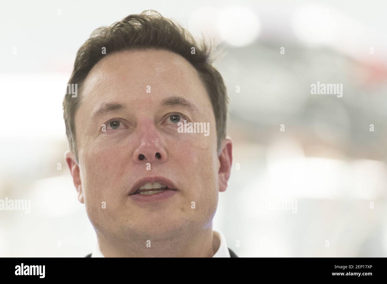 SpaceX Chief Engineer Elon Musk speaks to media in front of Crew Dragon ...
