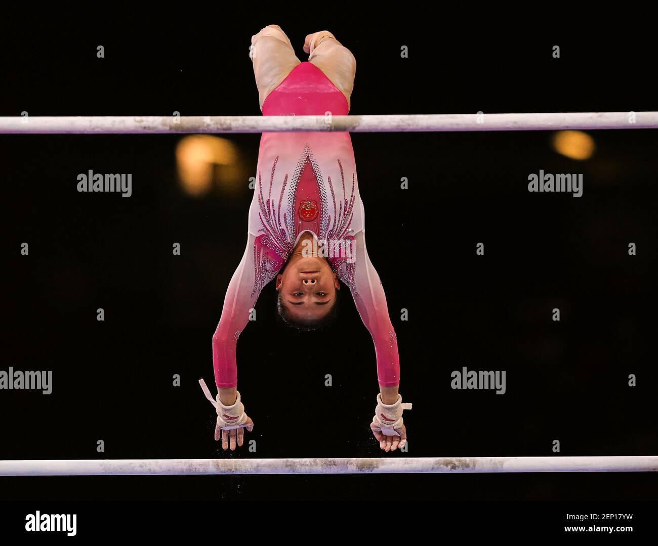 Shijia Li of China competing in uneven bars for women during the 49th ...