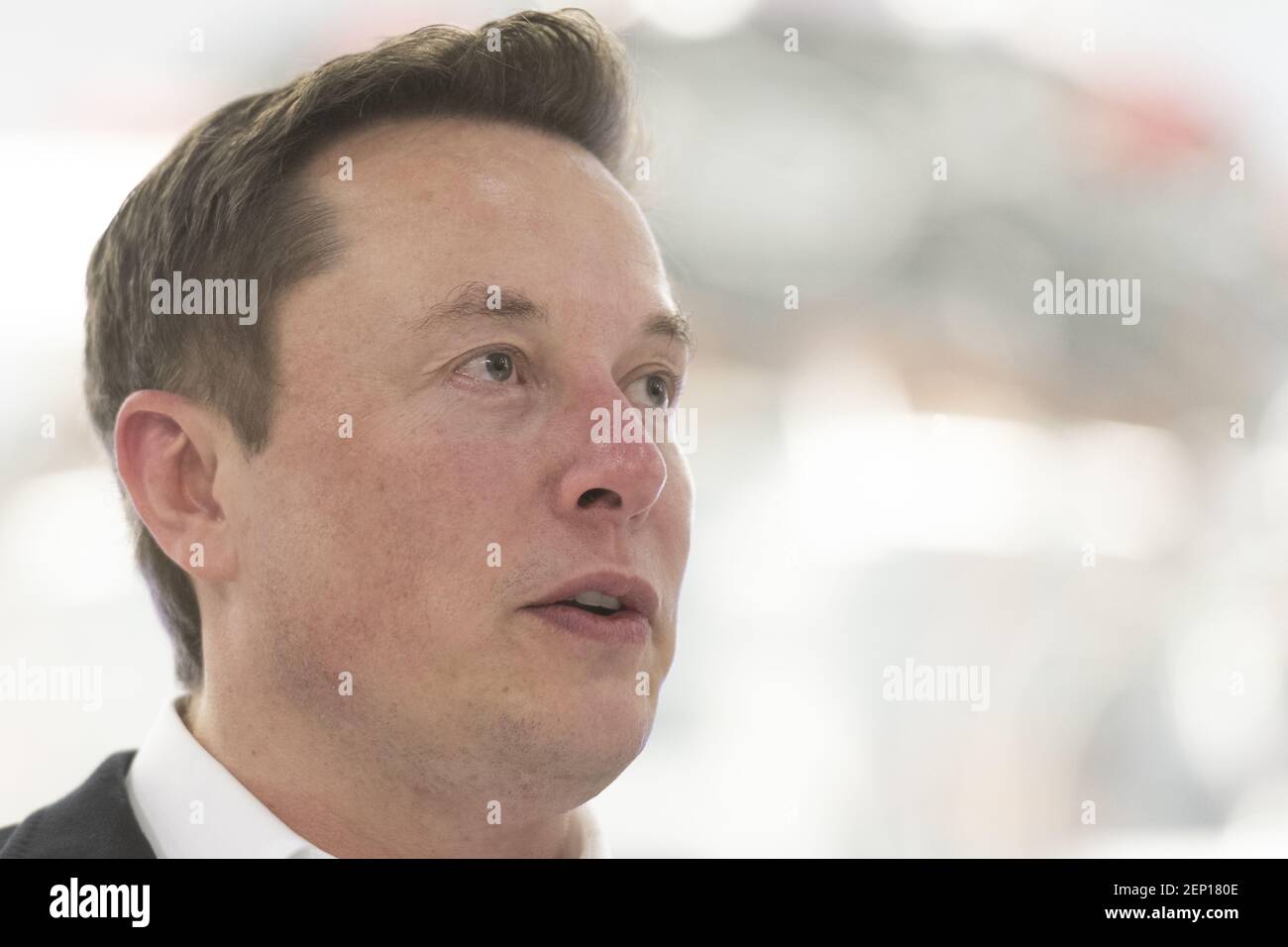 SpaceX Chief Engineer Elon Musk speaks to media in front of Crew Dragon ...